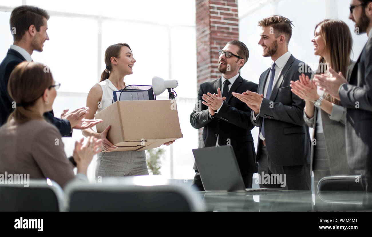 business team congratulating colleague on promotion Stock Photo - Alamy