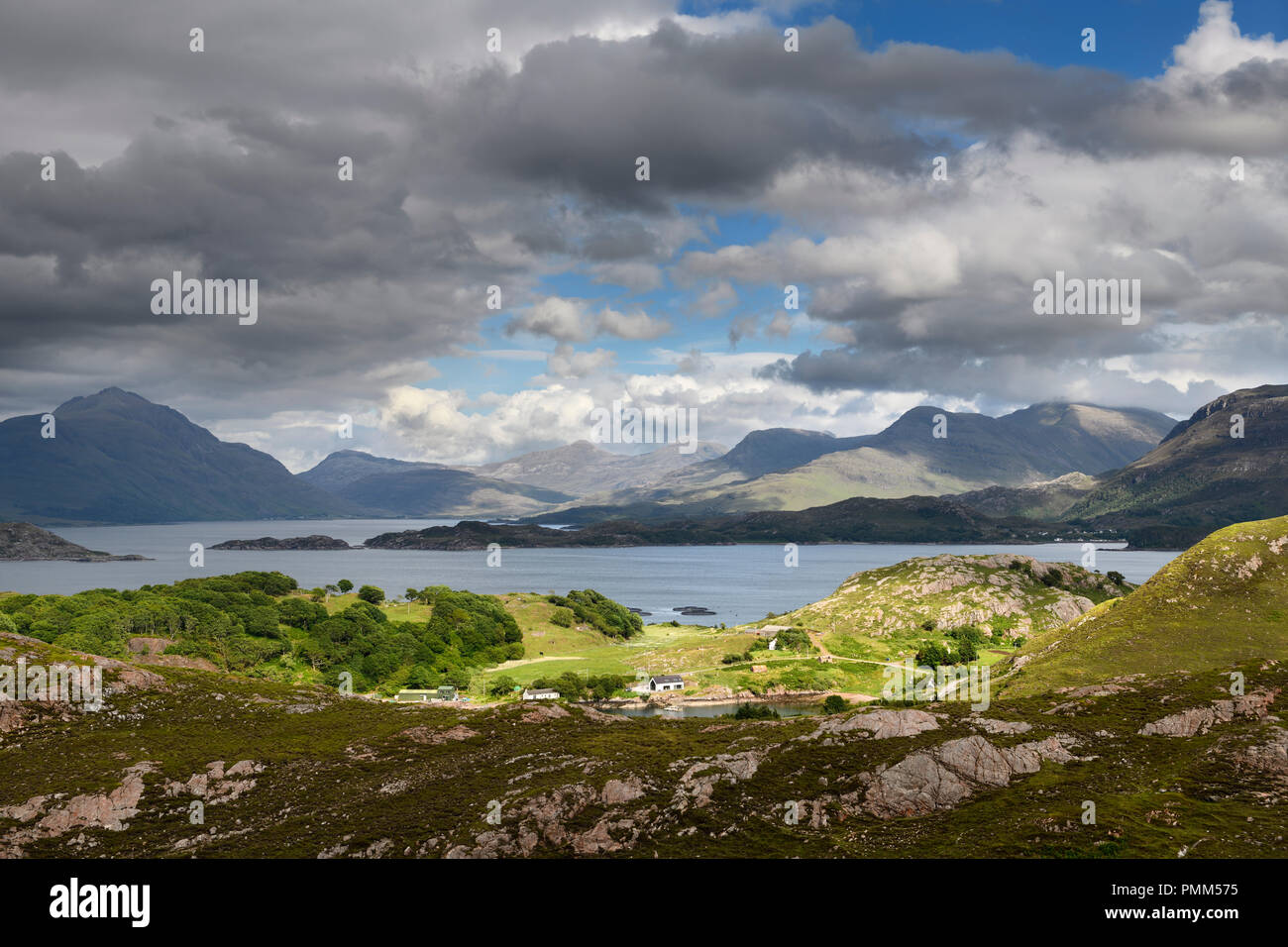 Ardheslaig village on Loch Beag and Loch Shieldaig with dappled sun and ...