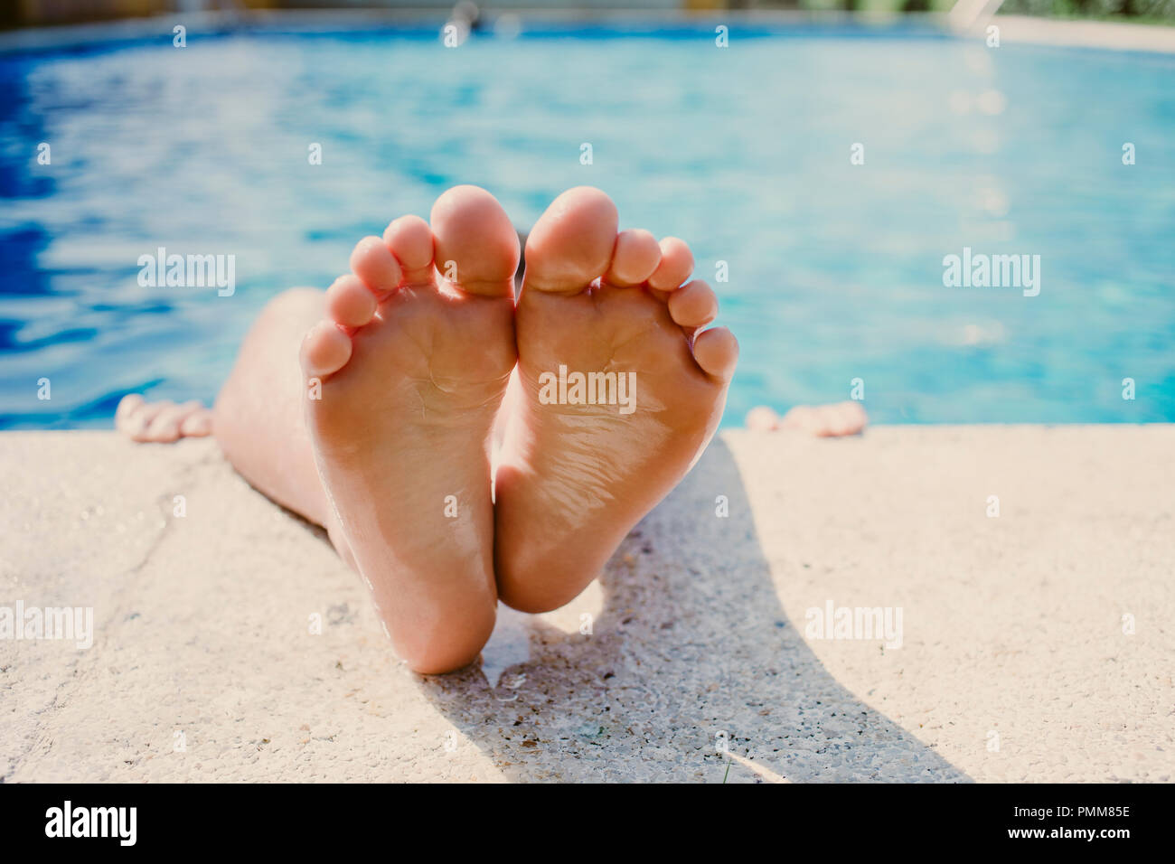 Boys lying pool hi-res stock photography and images - Alamy