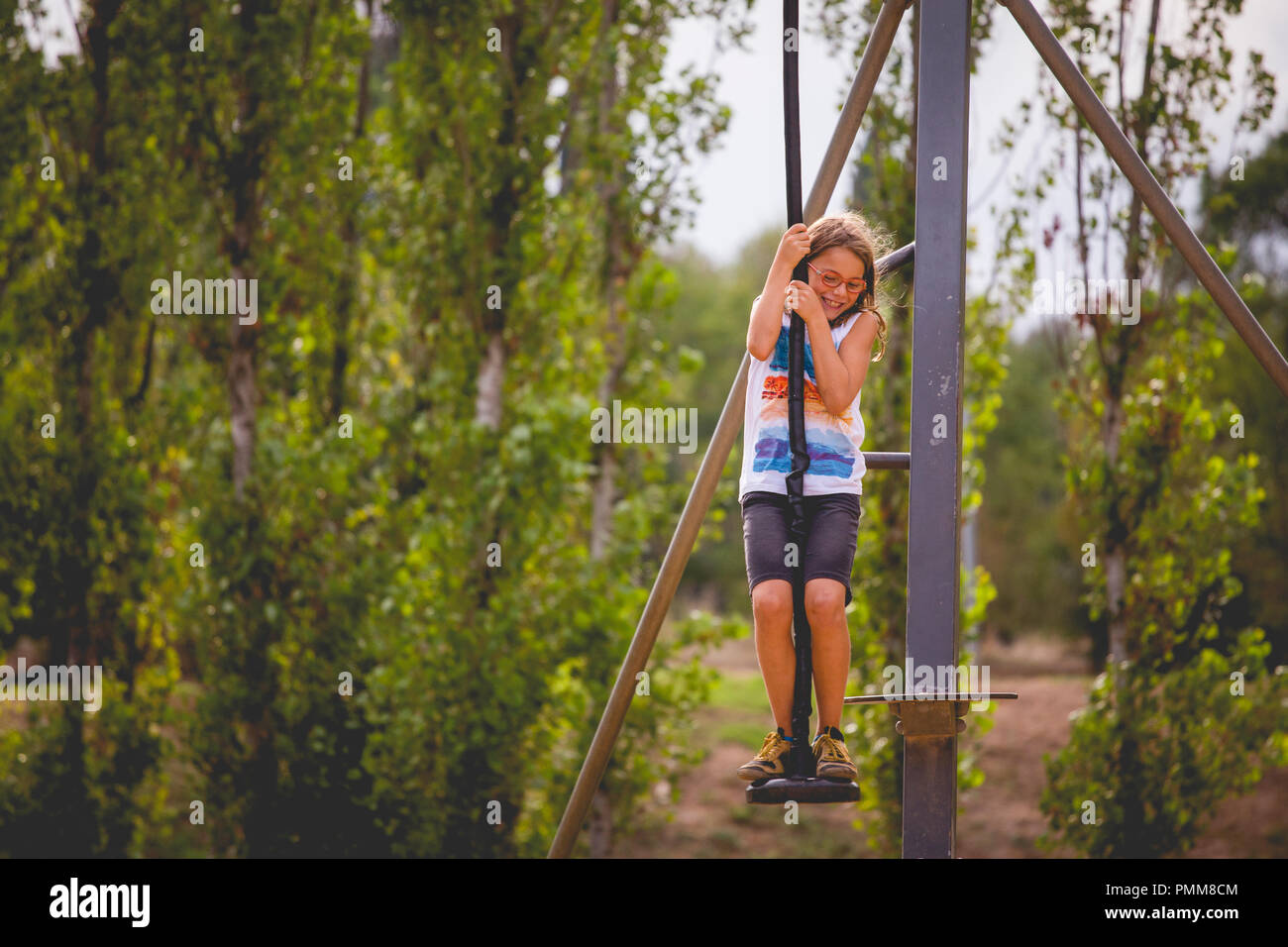Boy on a zip-line in a park, Spain Stock Photo - Alamy