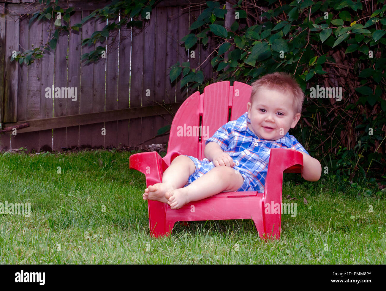 Boy in plastic chair hi-res stock photography and images - Alamy