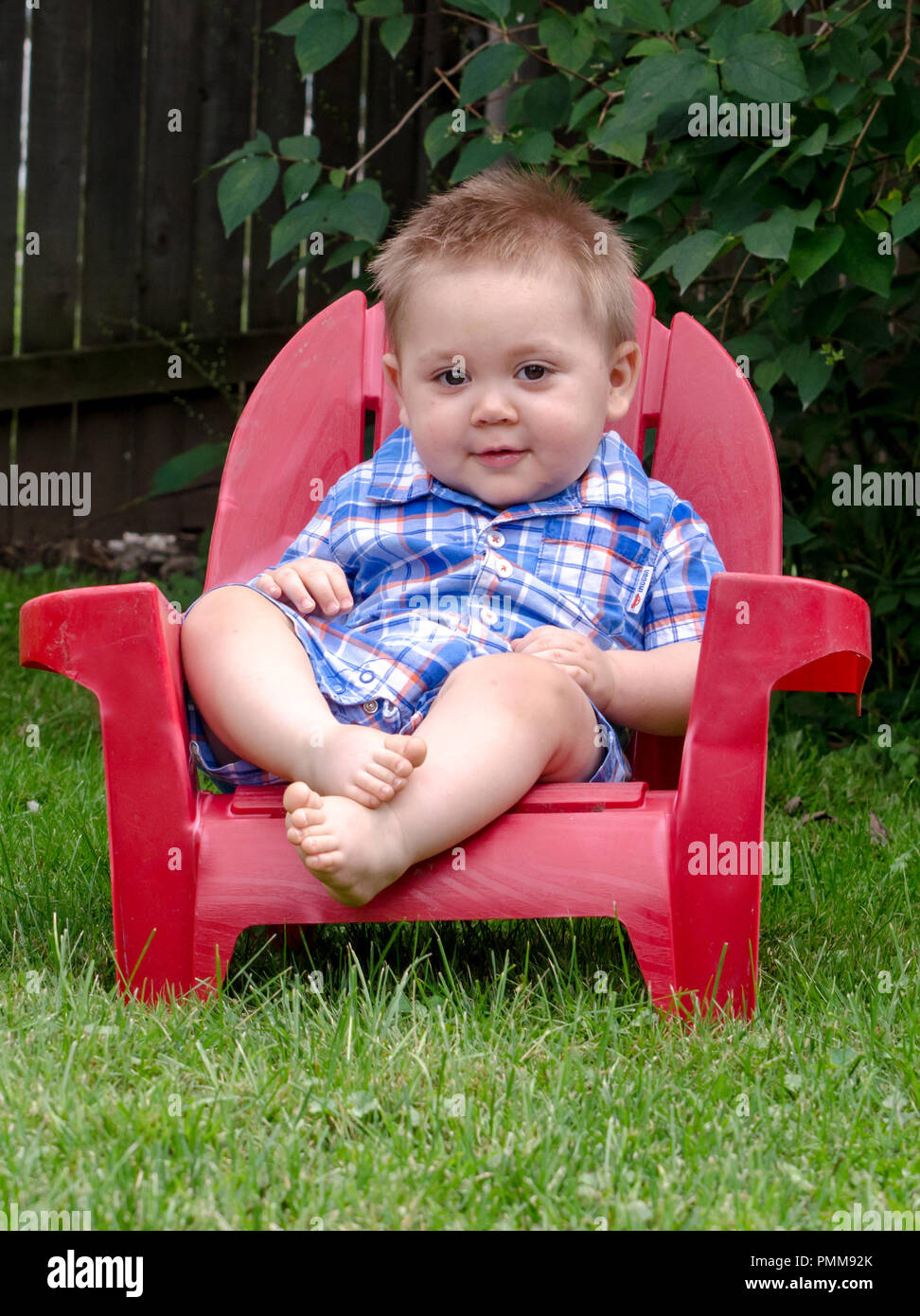 Boy in plastic chair hi-res stock photography and images - Alamy