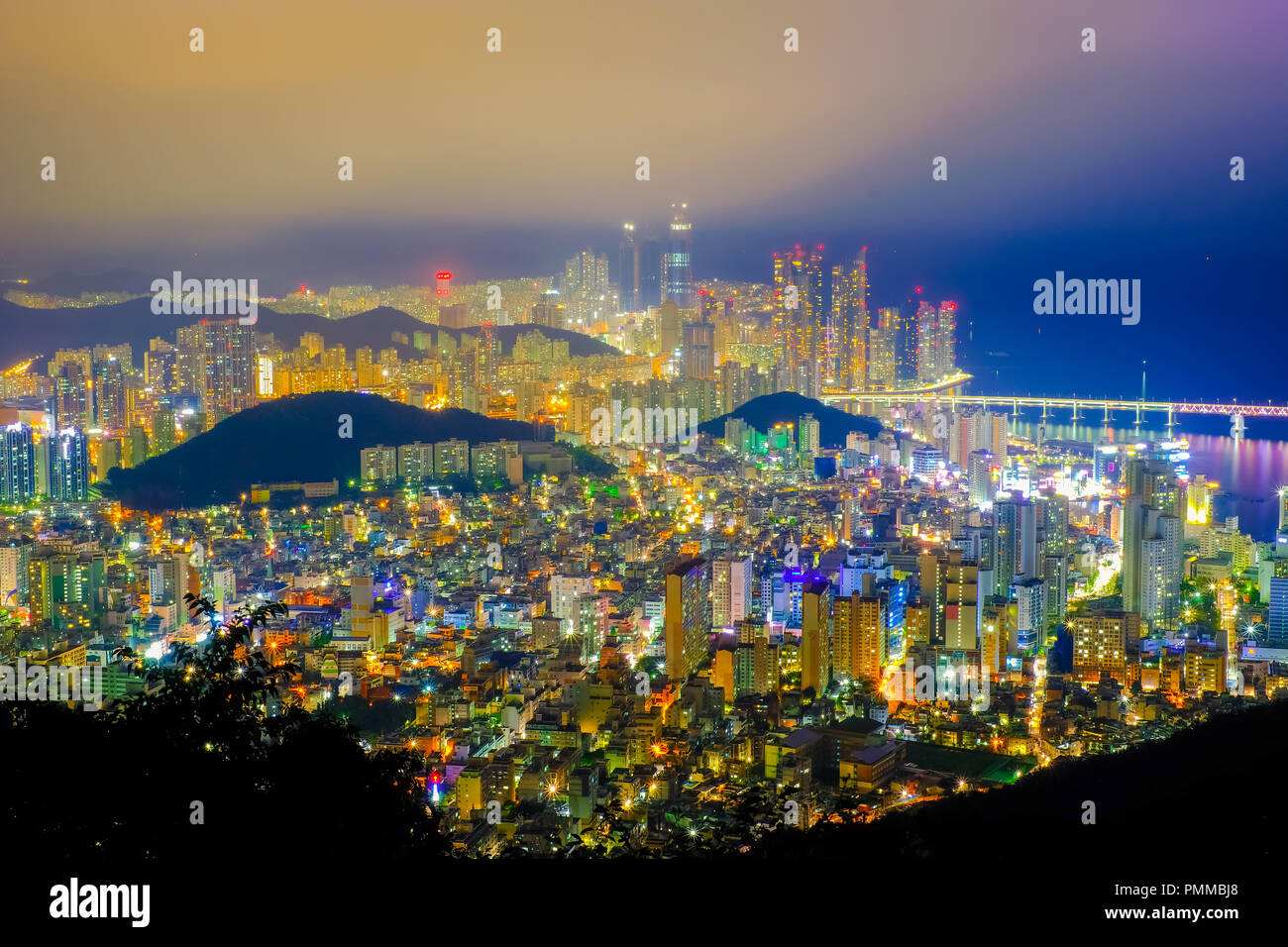 Aerial view of Busan city with Gwangan bridge at nighttime, South Korea ...