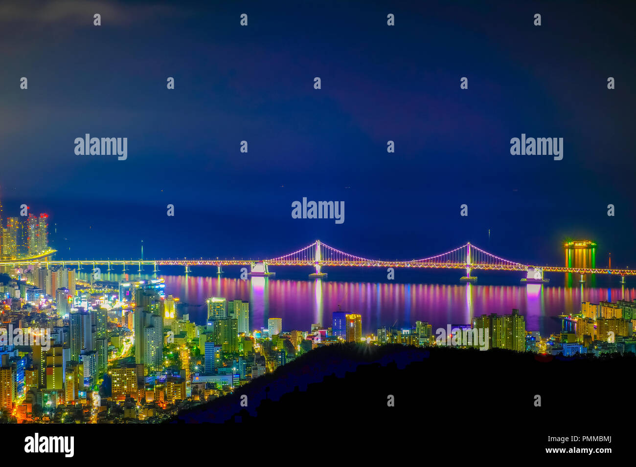 Aerial view of Busan city with Gwangan bridge at nighttime, South Korea ...