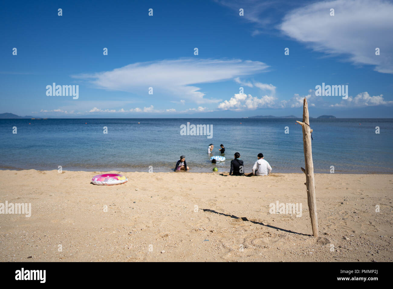 Girls Swimming in Beach Stock Photo - Alamy