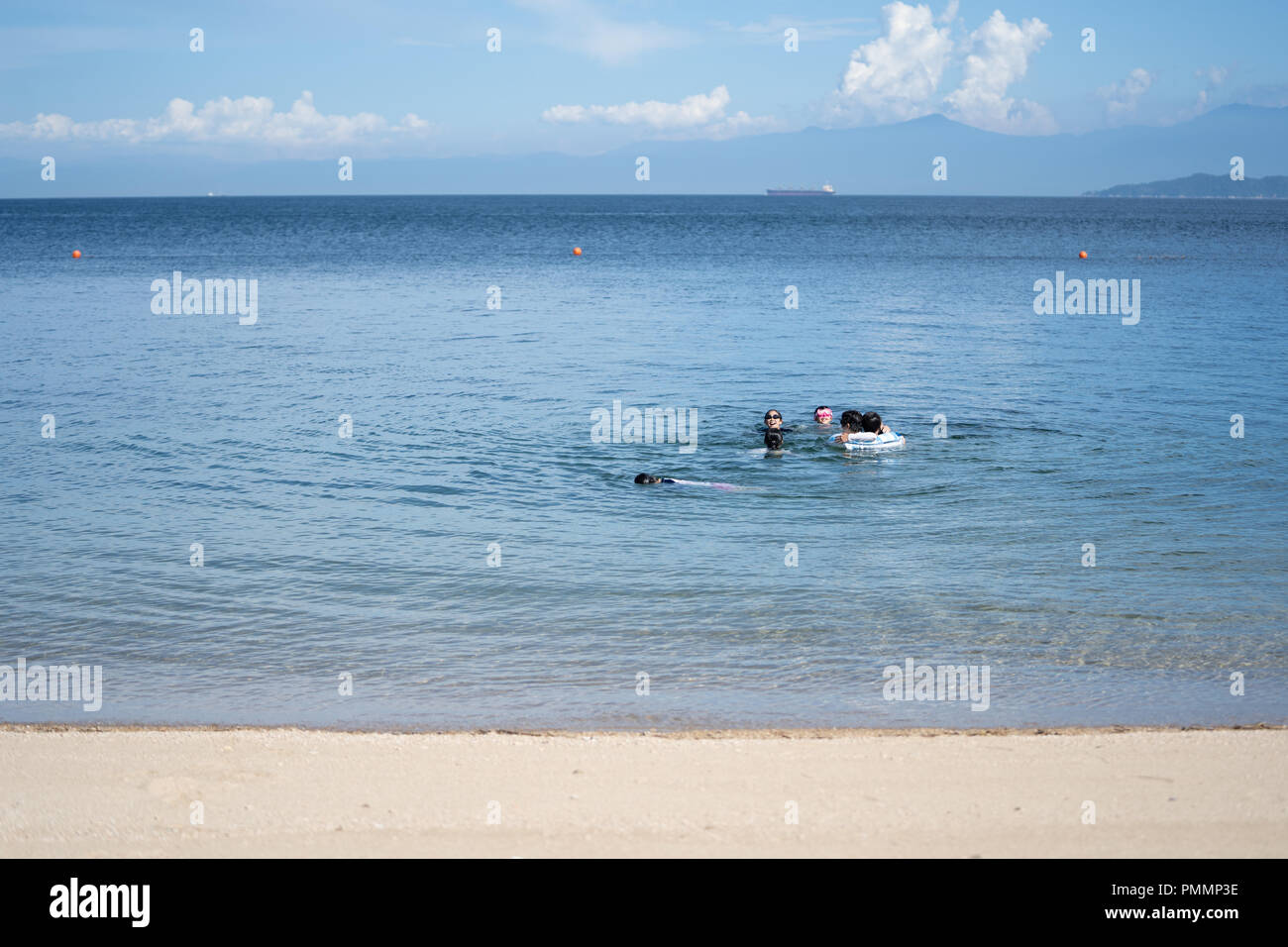 Girls Swimming in Beach Stock Photo - Alamy