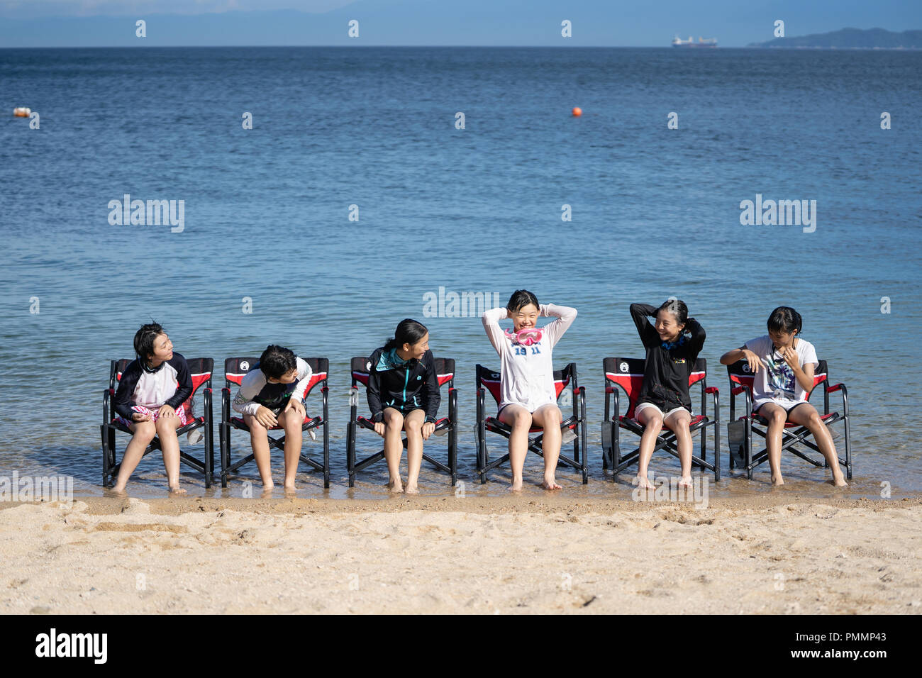Girls Swimming in Beach Stock Photo - Alamy