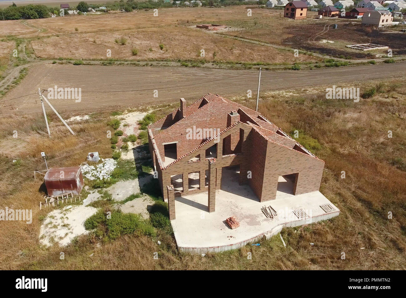 The house is built of red brick. The walls of the house are a top view ...