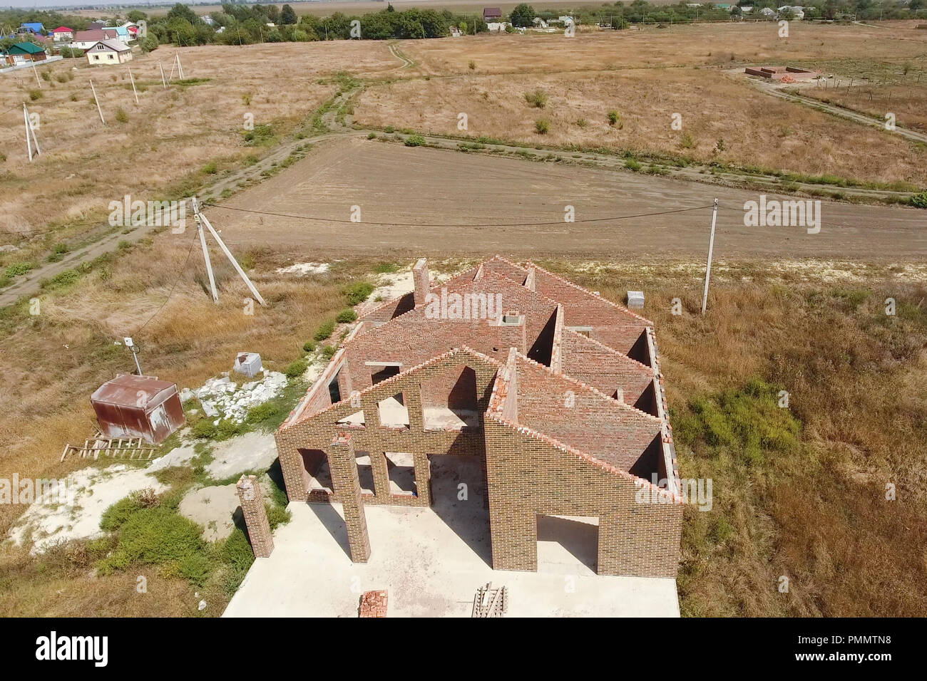The house is built of red brick. The walls of the house are a top view ...