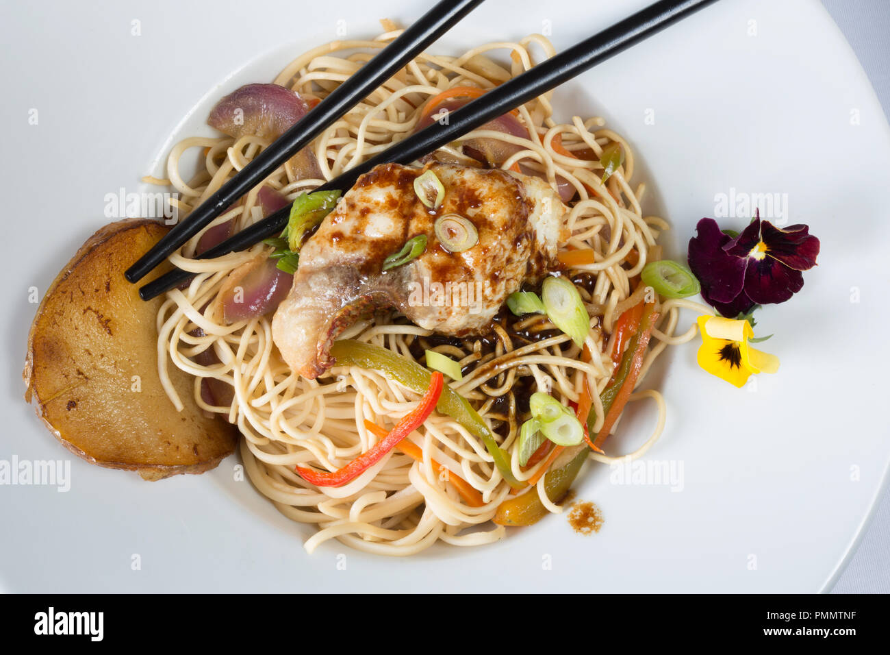 Middle eastern style dish of pan fried Red Snapper with stir fried ...