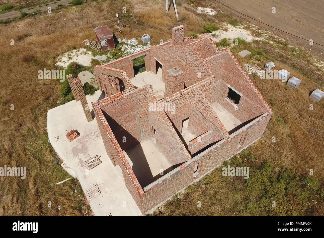 The house is built of red brick. The walls of the house are a top view ...