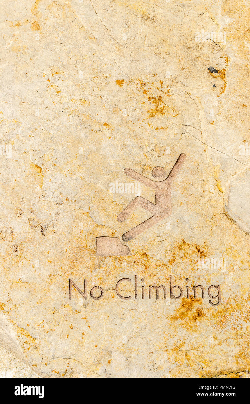 Warning sign on rock to keep people from getting hurt Stock Photo - Alamy