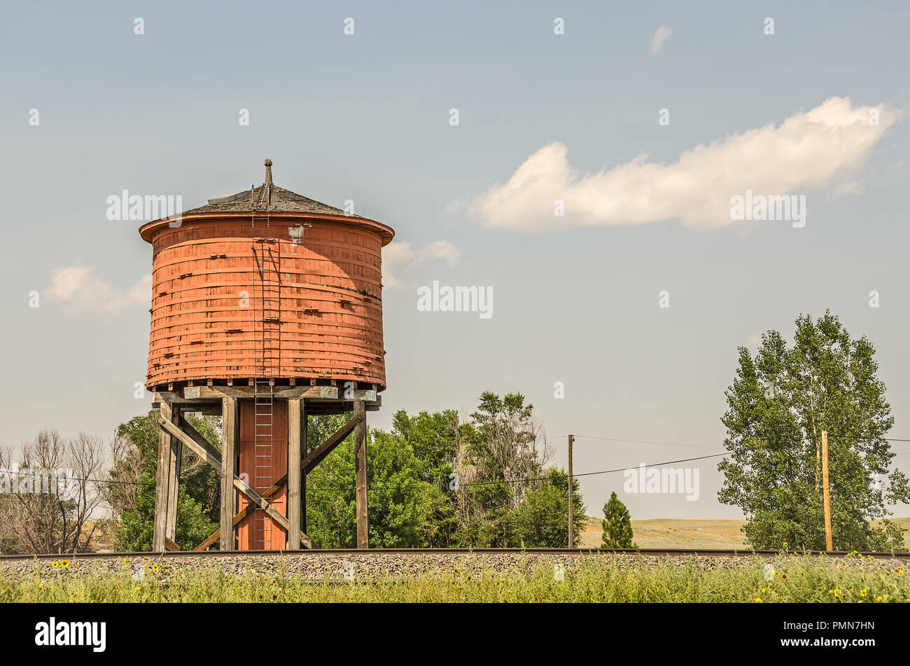 Built by a railroad company, the red water tank stored water for steam ...
