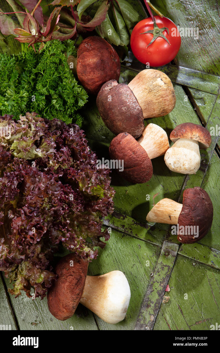 Mushrooms and vegetable on an old wood Stock Photo - Alamy
