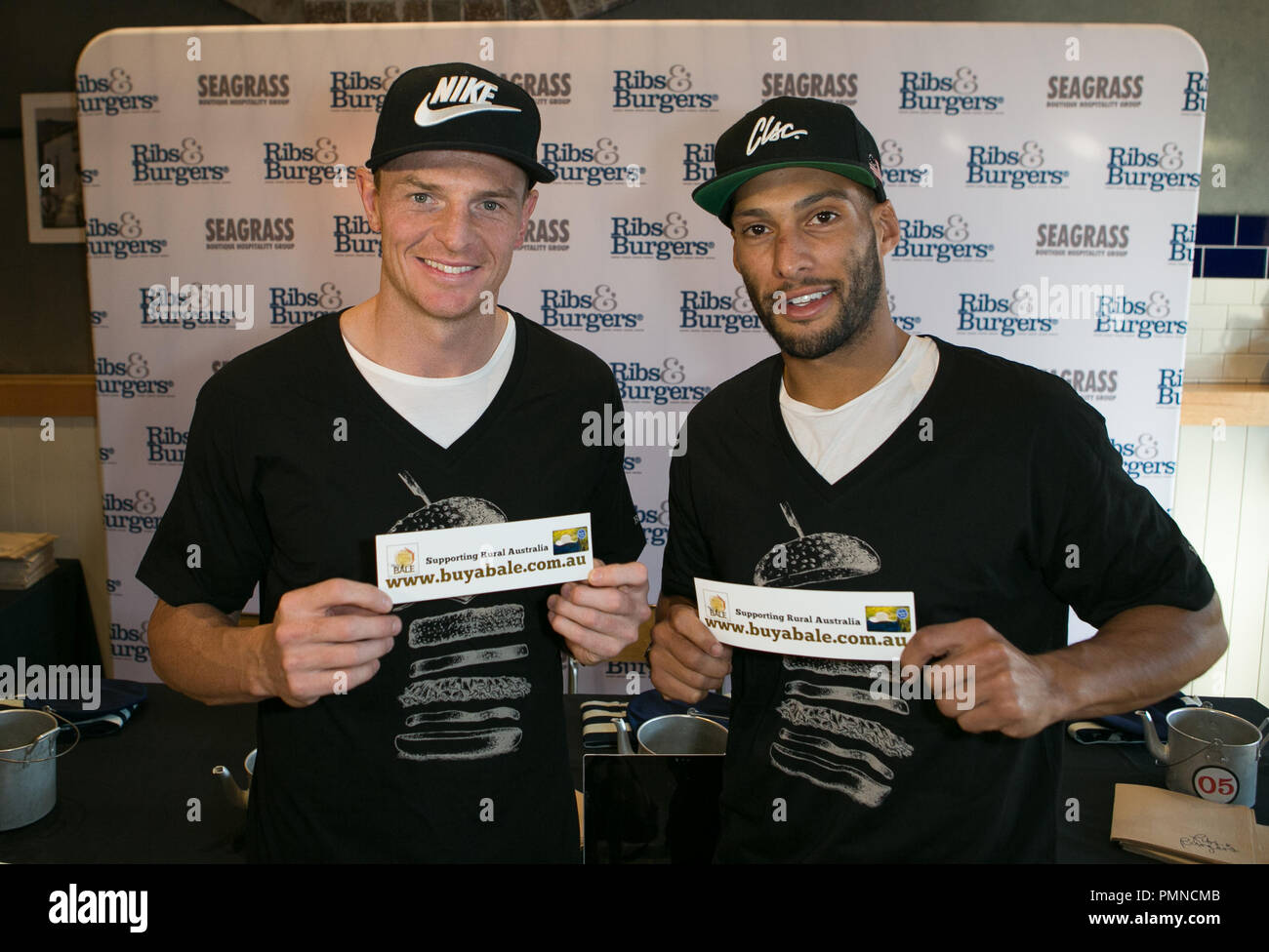 AFL players Brendon Goddard & Josh Gibson at a rib eating competition ...