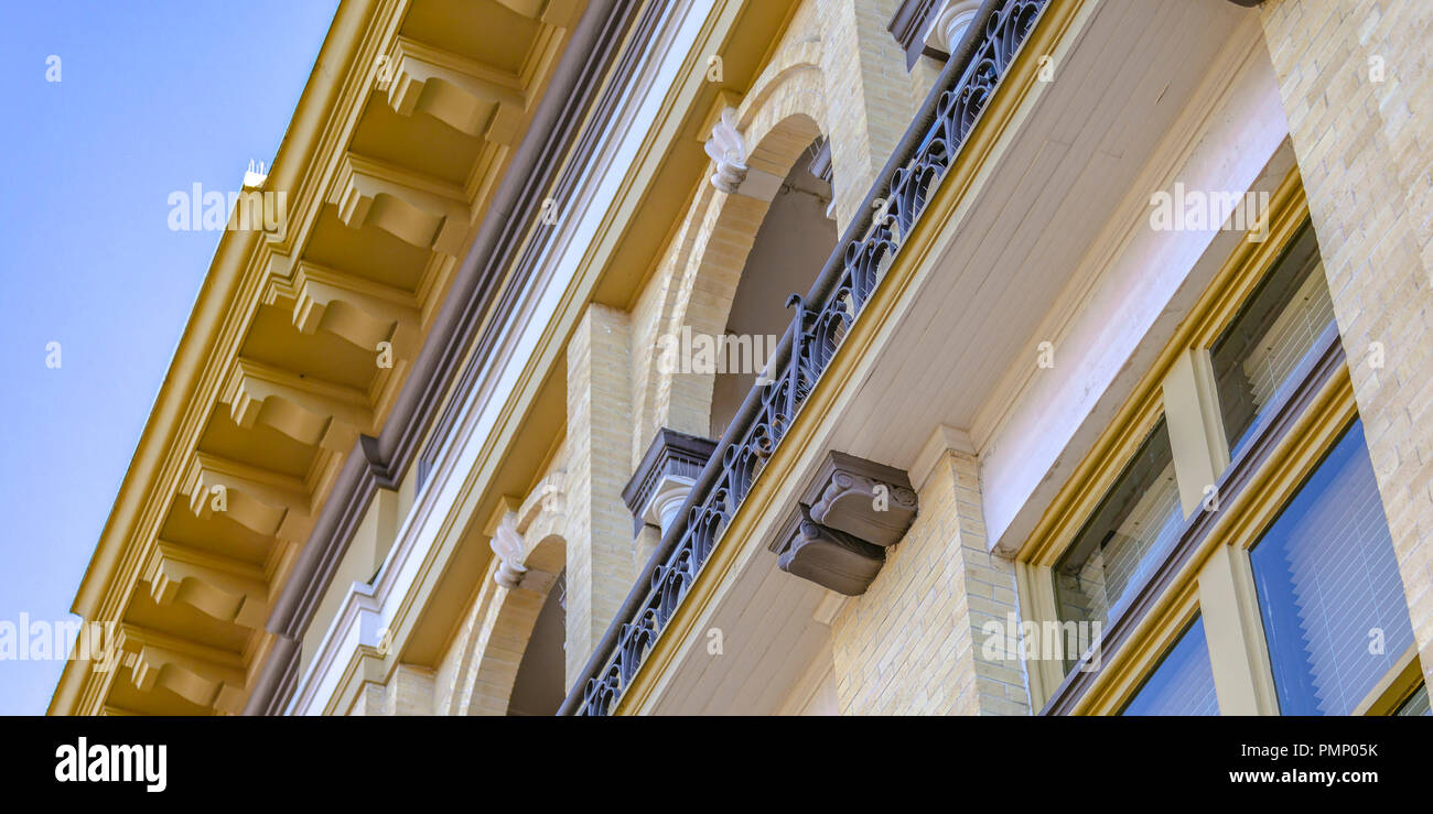 Building with brick wall and balcony Stock Photo - Alamy