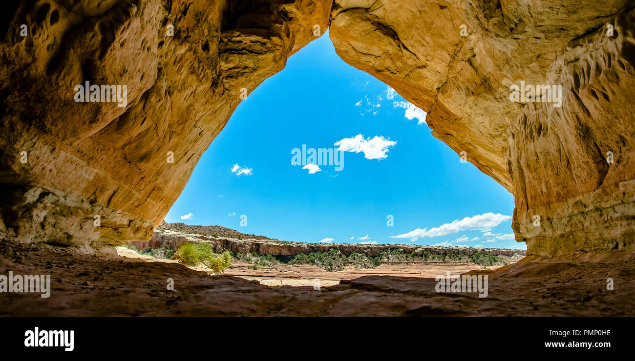 Entry way of a cave in Moab Utah Stock Photo - Alamy