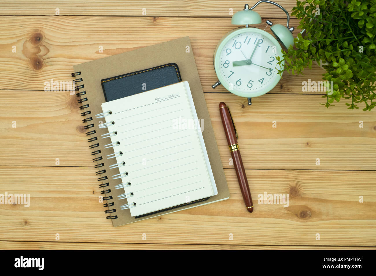 Office supplies or office work essential tools items on wooden desk in ...