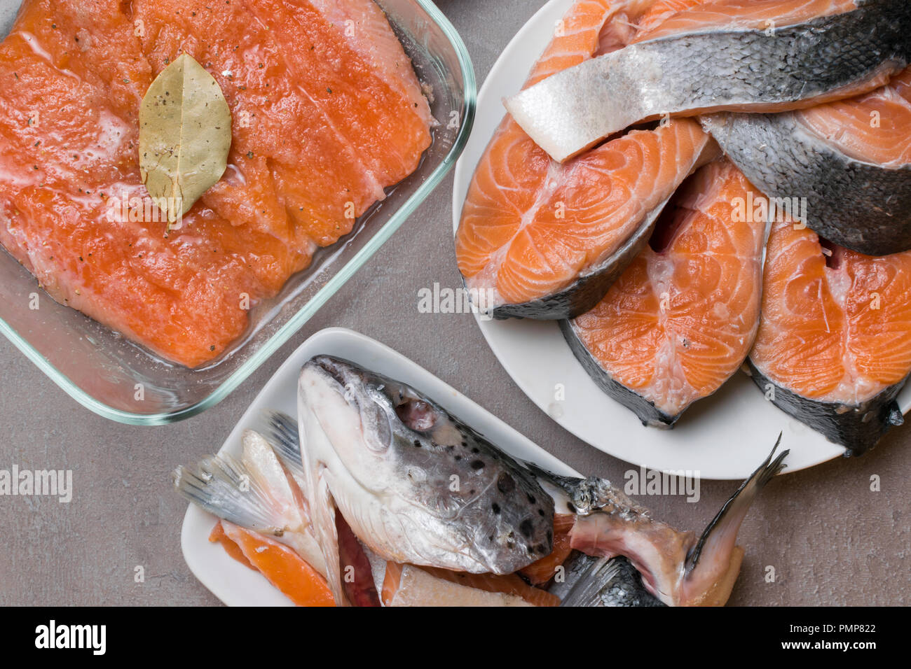Salmon or trout fish splitting on grey table. Salmon fillet, filler ...