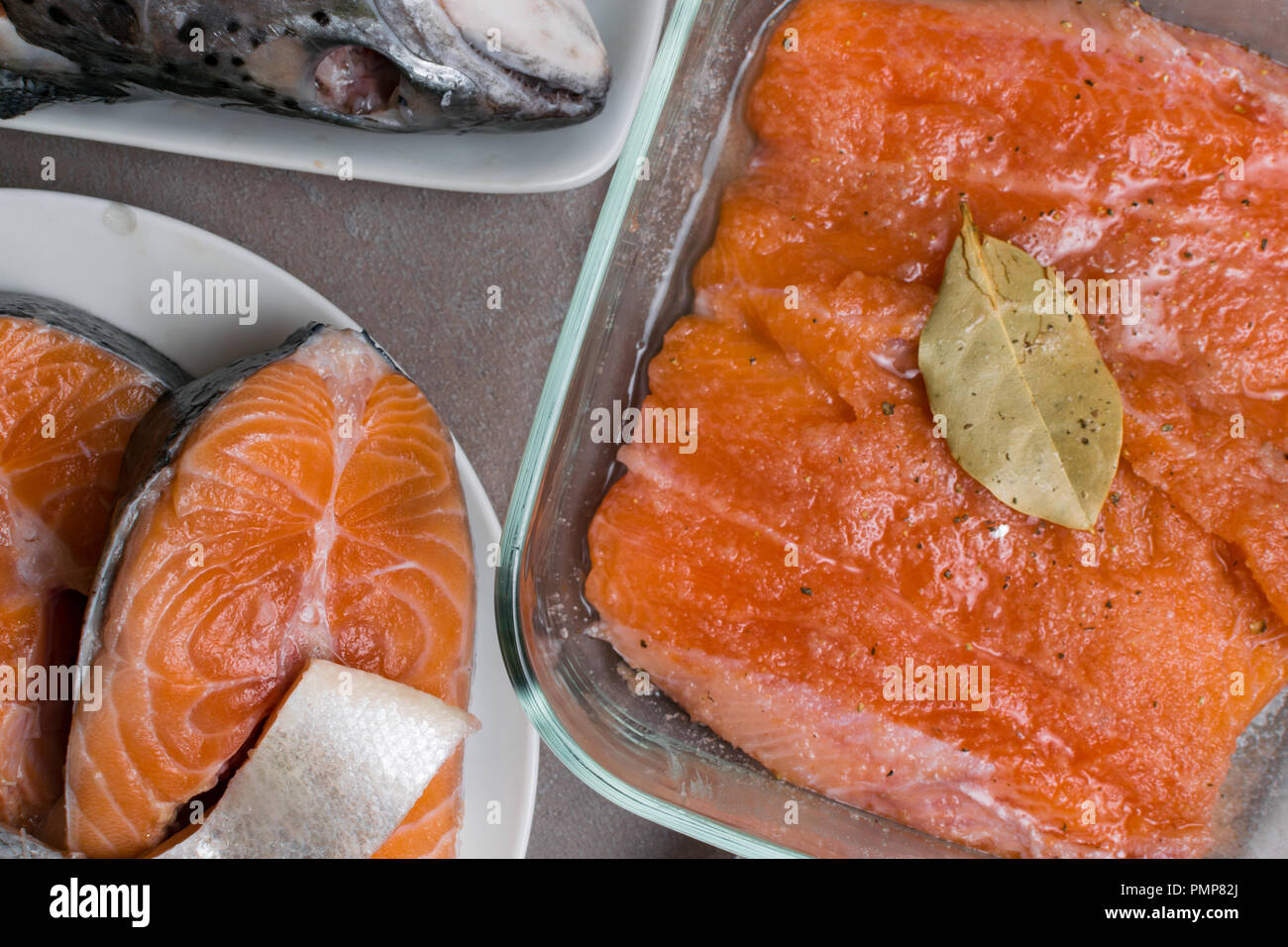 Salmon or trout fish splitting on grey table. Salmon fillet, filler ...