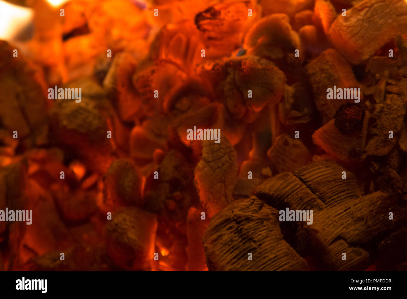 Coal glowing in the fireplace soft focus background Stock Photo - Alamy