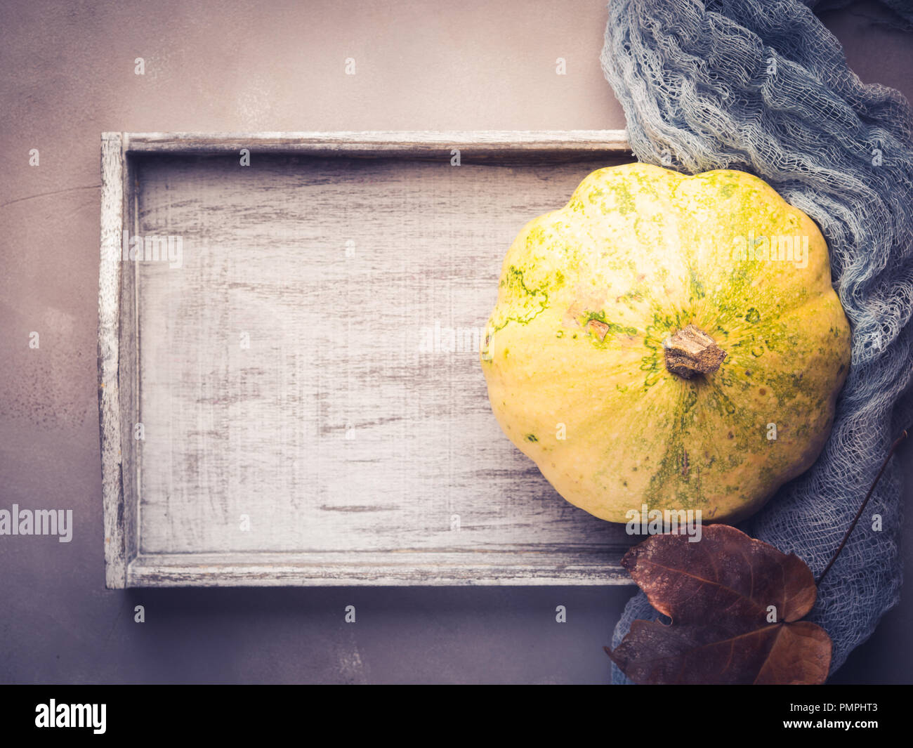 Autumn fall flat lay background with decorative pumpkin on wooden tray ...
