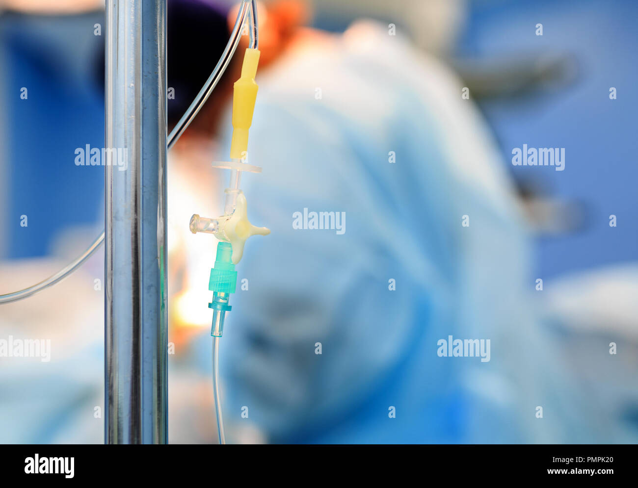 Medical drop counter on the blurry background of the group of doctors ...
