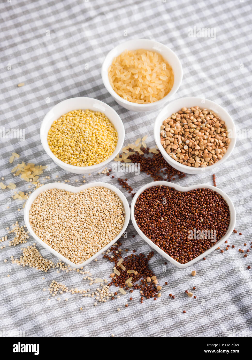 Gluten free grains quinoa, rice, buckwheat, amaranth, millet in bowls ...