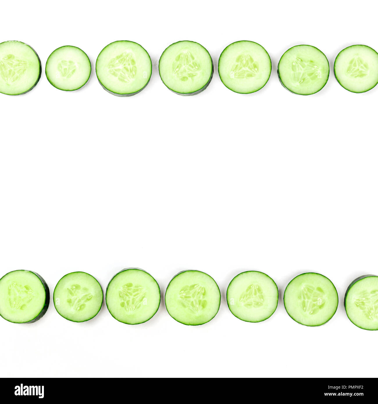 Sliced cucumber on a white background, forming a square frame for ...