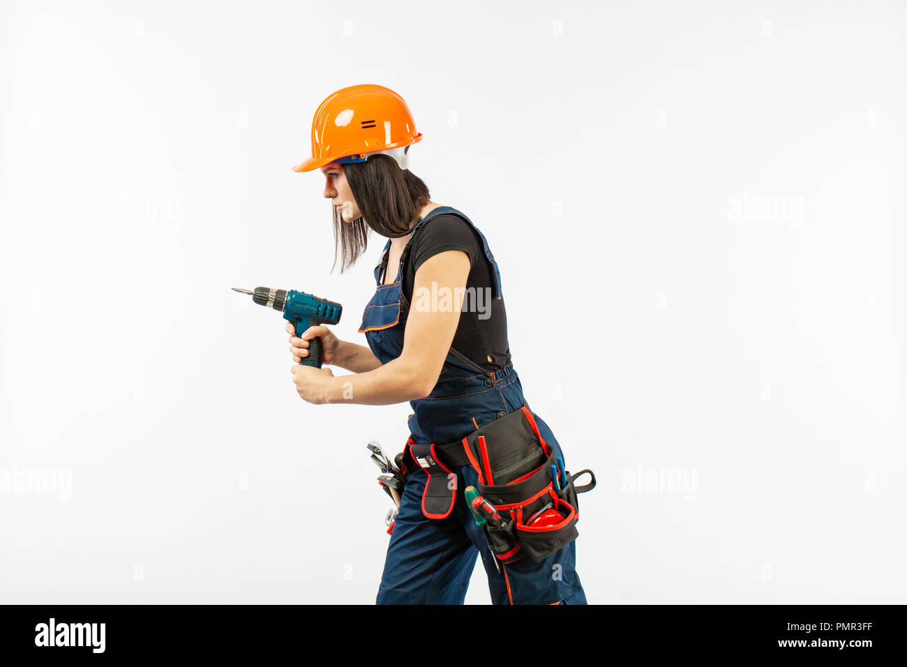 Woman with tool belt diy hi-res stock photography and images - Alamy