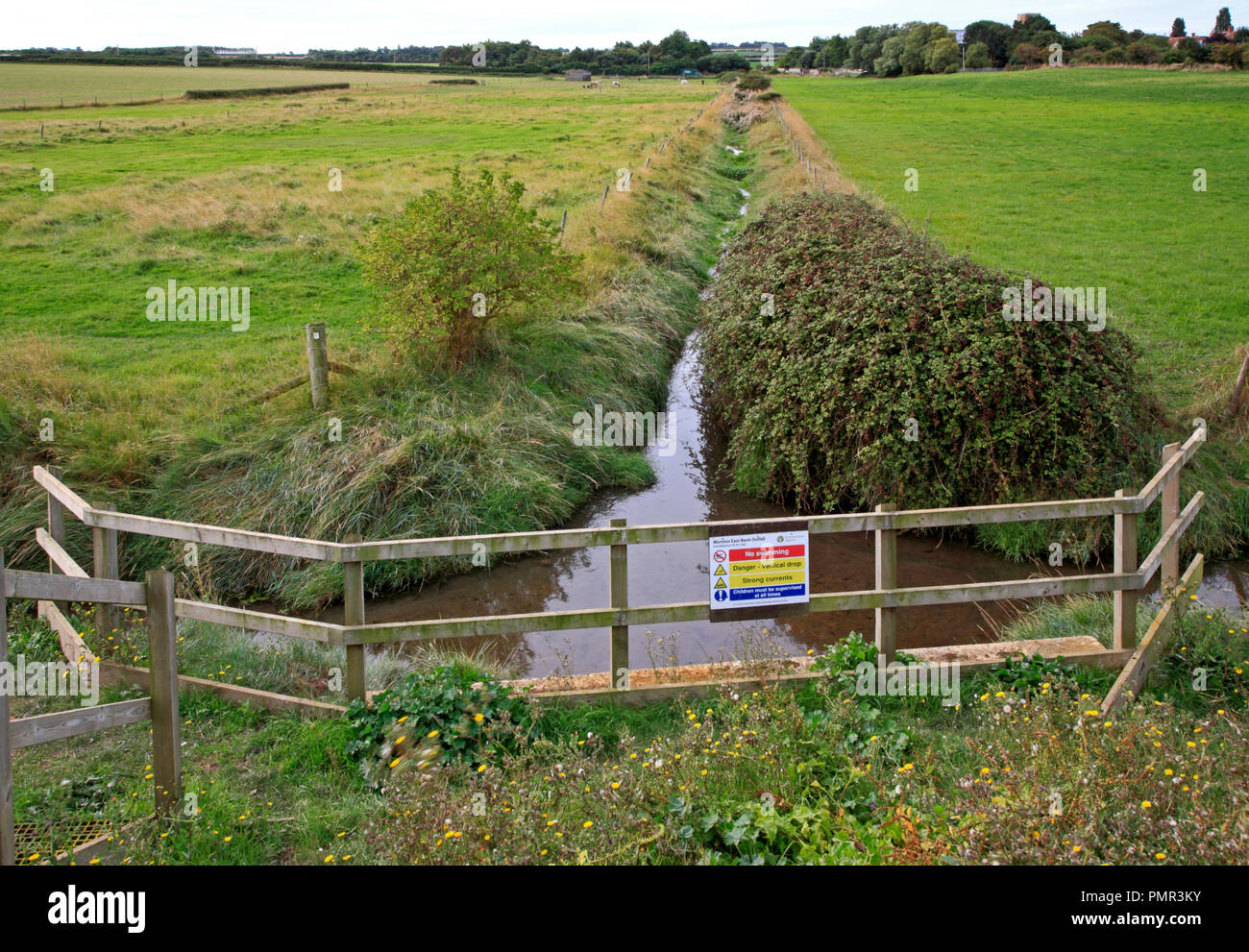A land drainage ditch meeting the Norfolk Coast Path for discharge into ...