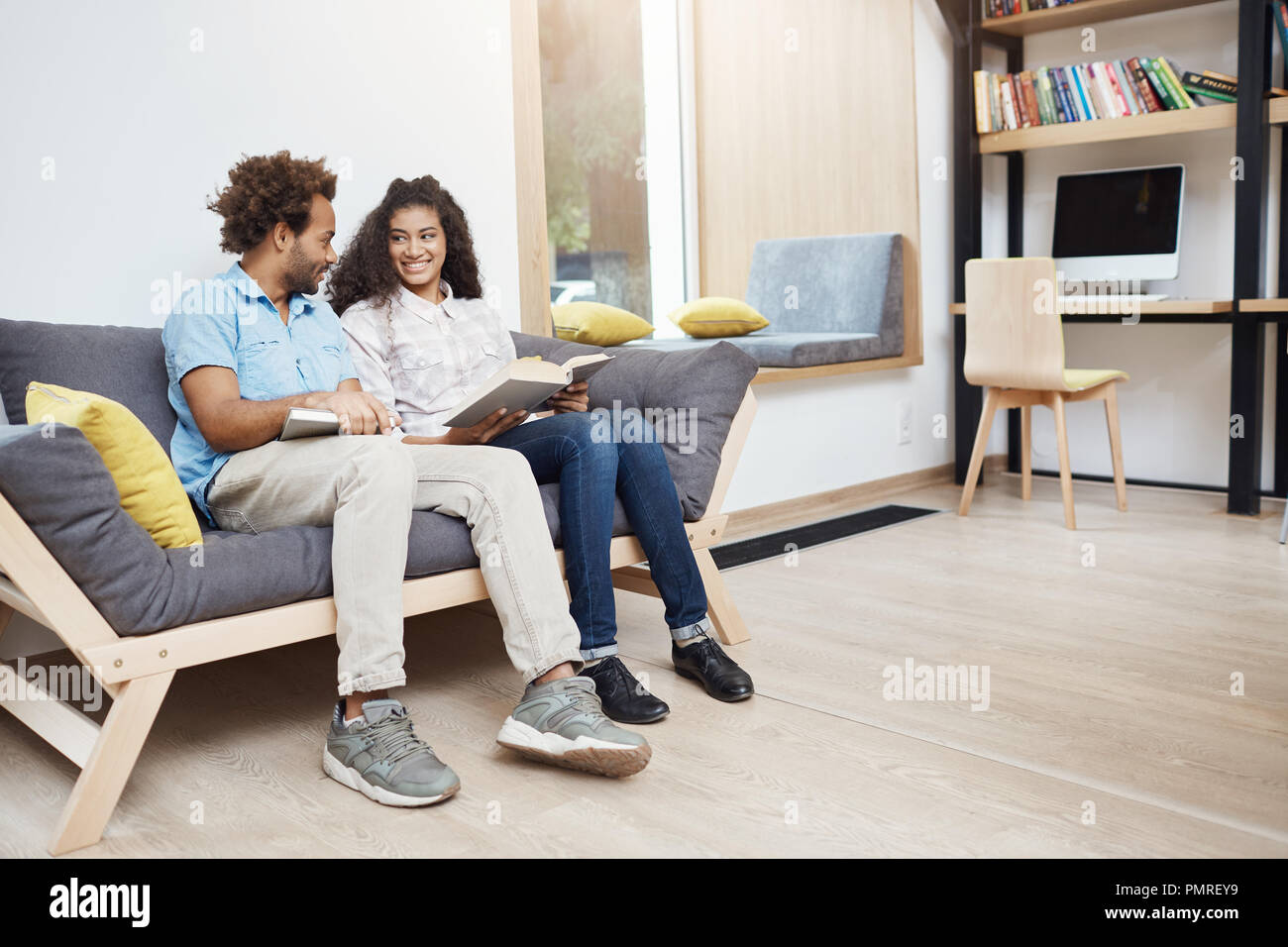 Education laughing reading papers hi-res stock photography and images ...