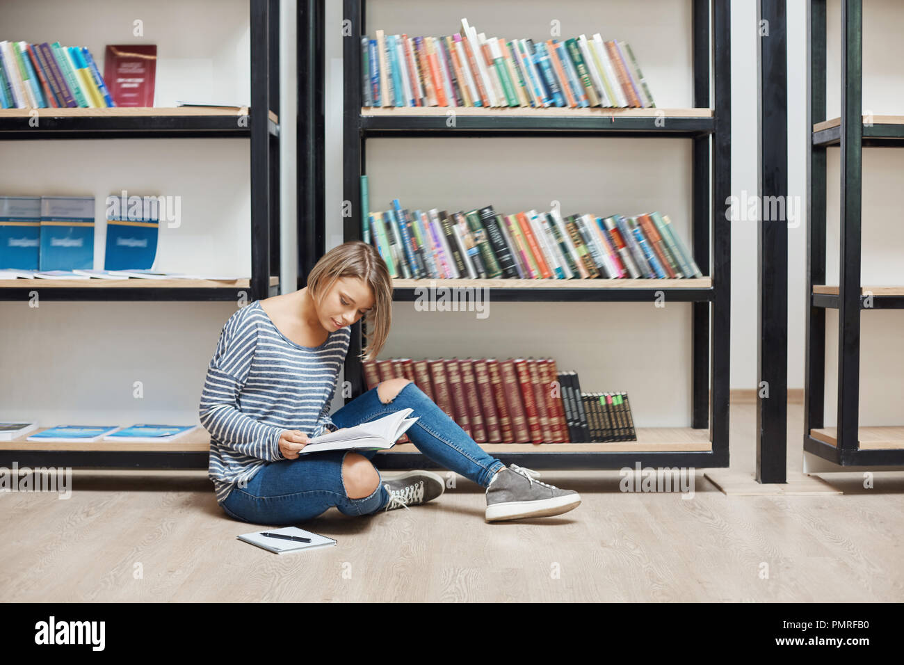 Portrait of young good-looking student girl with short blonde hair in ...