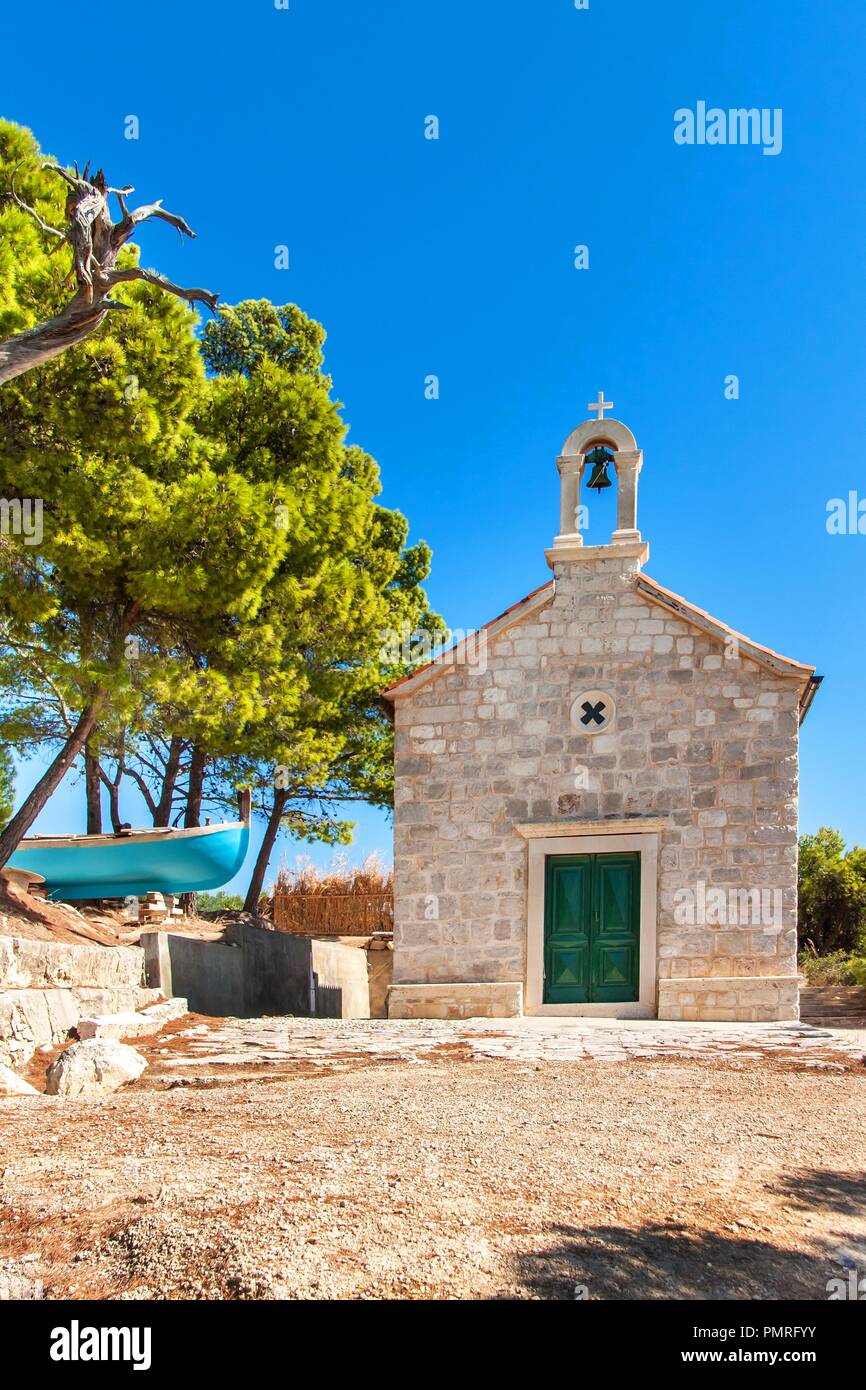 Old stone church in Croatia on the island of Hvar. Hot day at the ...