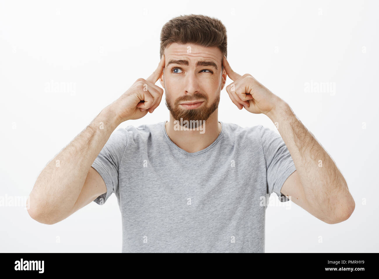 Guy trying focus, think up new plan. Determined, thoughtful handsome ...
