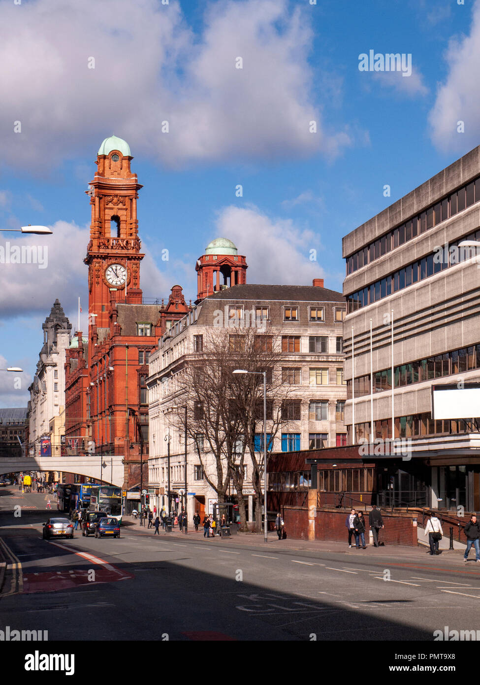 Oxford Road view with the clock tower of Palace hotel in Manchester UK ...