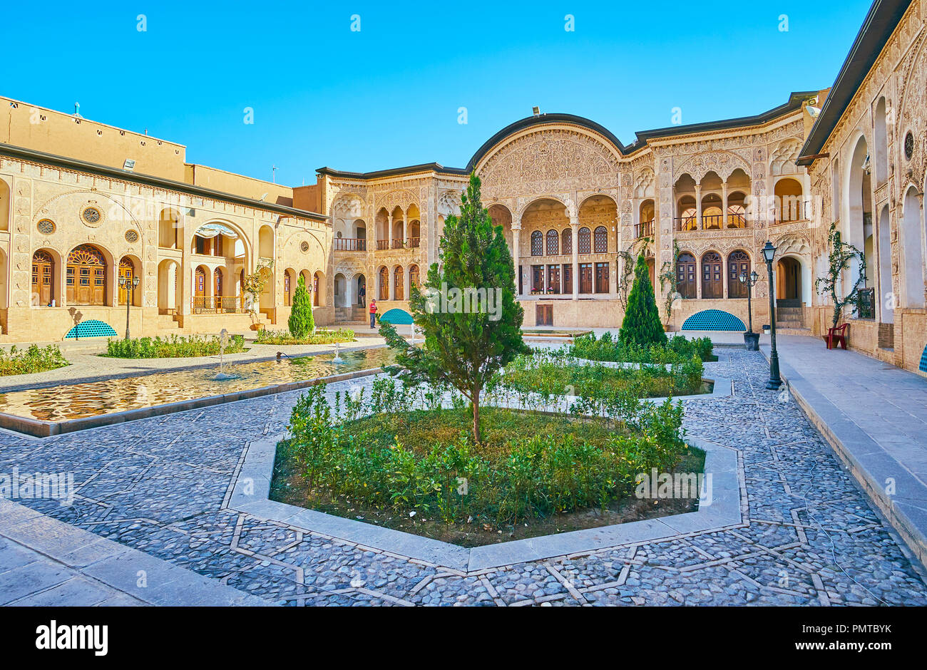 KASHAN, IRAN - OCTOBER 22, 2017: The nice ornamental garden of Tabatabaei House with fountain ...