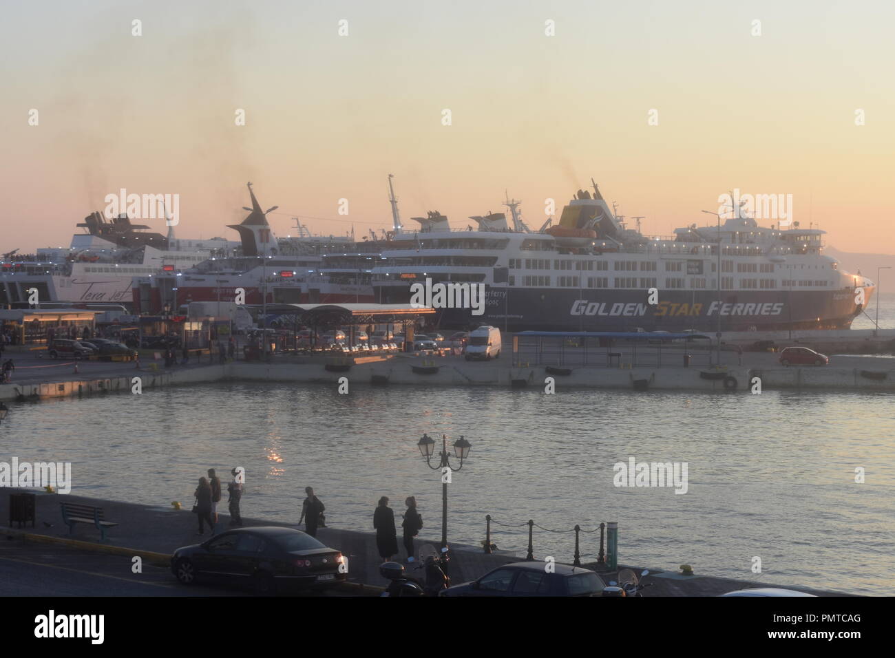 Boats moored at the port of Rafina near Athens. The sun is rising and ...