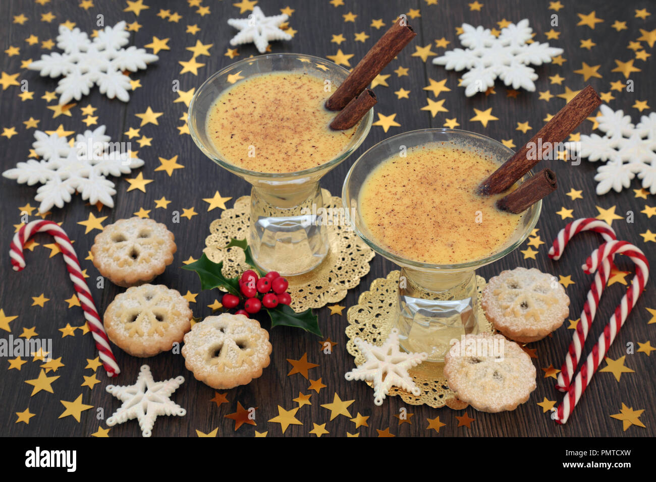 Christmas celebration with eggnog, mince pies, candy canes, star and ...