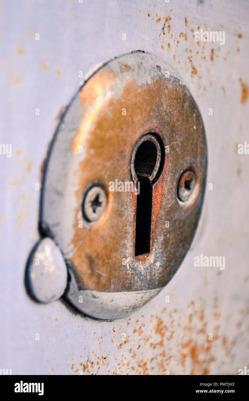 Old, rusty door lock on a grey door in an old building Stock Photo - Alamy