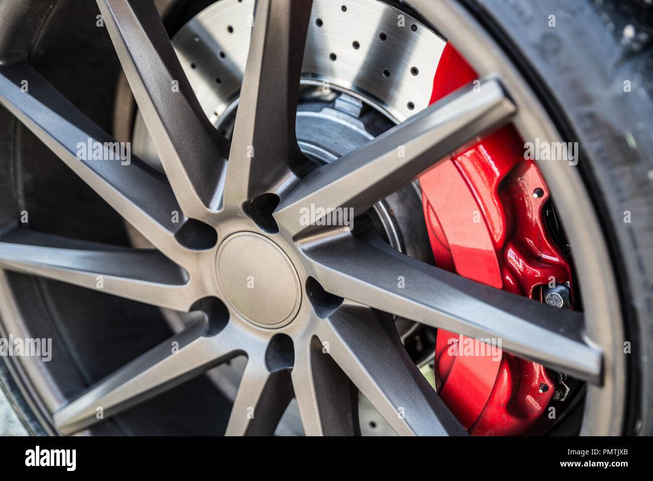Sports car braking system. Disc brake and brake caliper Stock Photo - Alamy