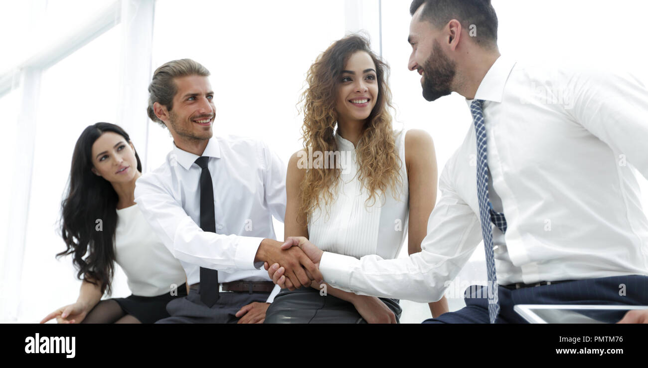 welcome handshake between two colleagues Stock Photo - Alamy