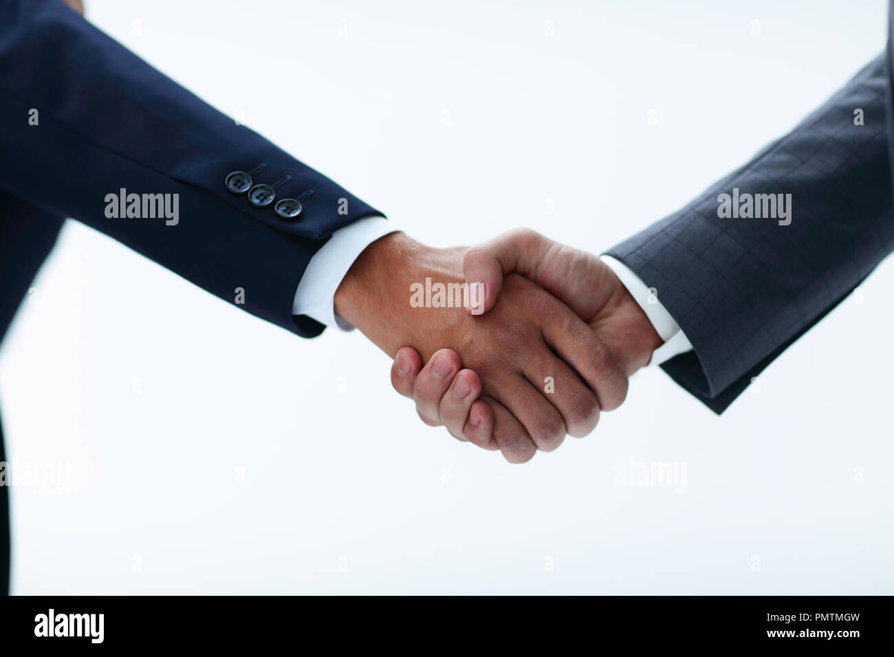 Business handshake - closeup shot Stock Photo - Alamy