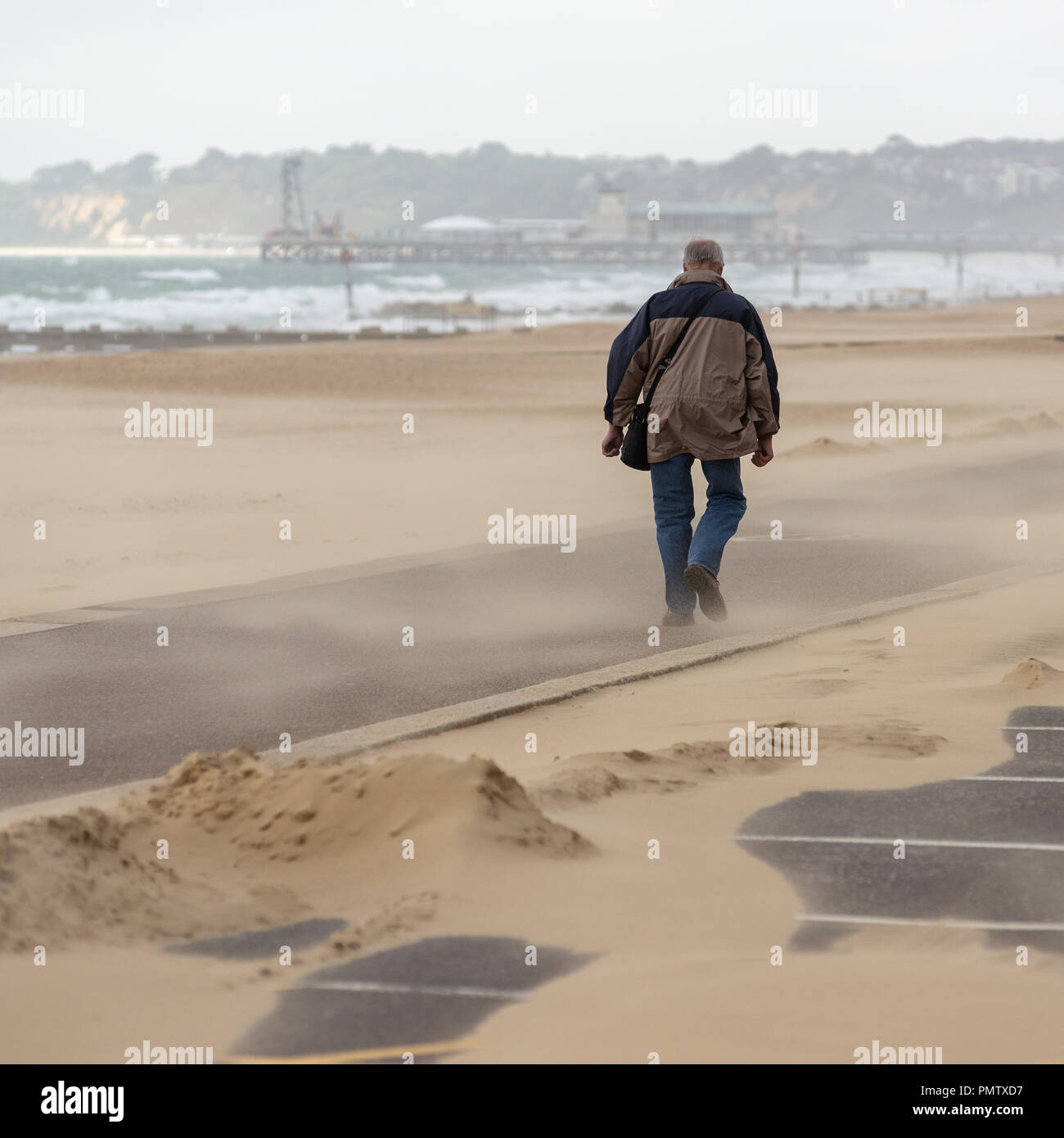 Windy weather man walking hi-res stock photography and images - Alamy