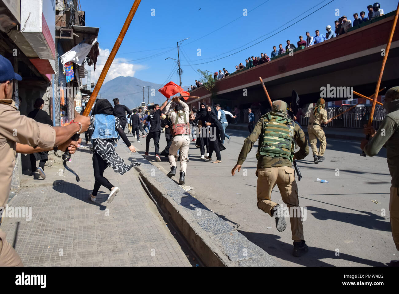 Indian police with sticks hi-res stock photography and images - Alamy