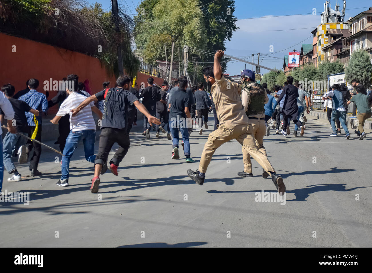 Indian police with sticks hi-res stock photography and images - Alamy