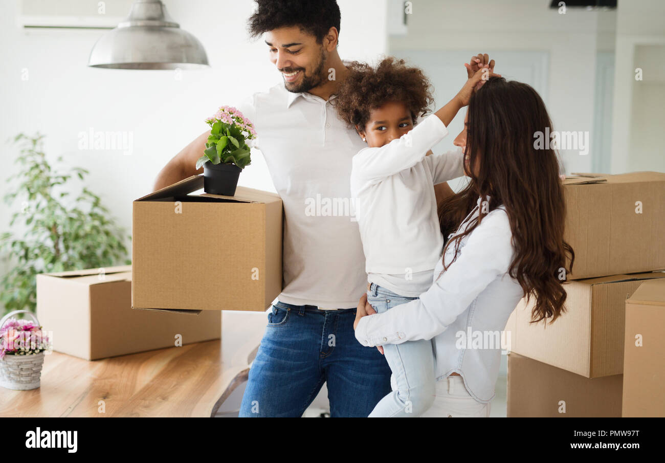 Happy family with cardboard boxes Stock Photo - Alamy
