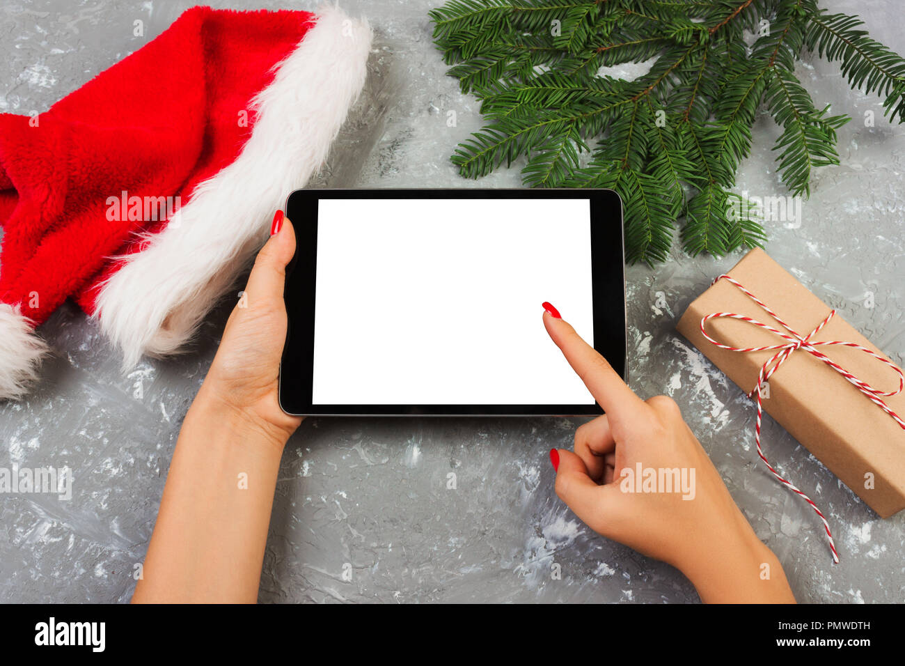 girl using tablet technology in home, person holding computer on ...