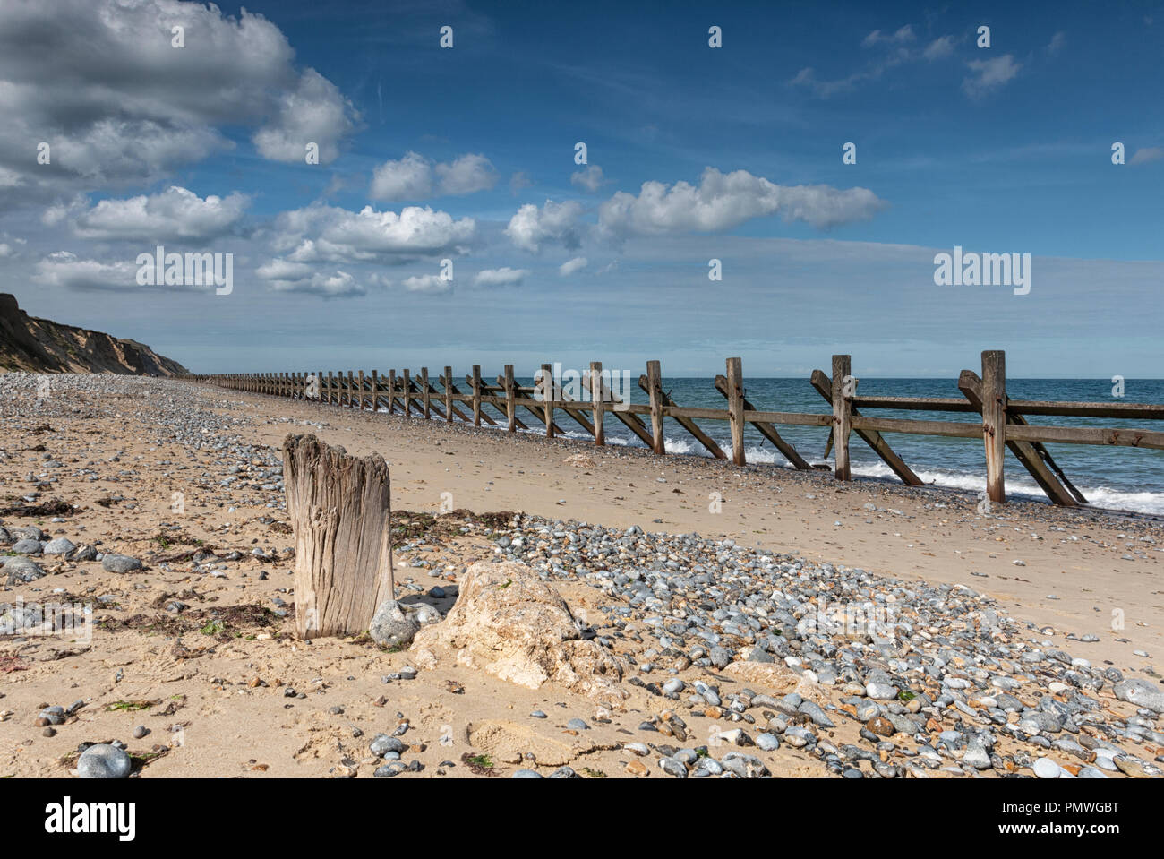 Wooden groynes and revetments on West Runton Beach, North Norfolk, East ...