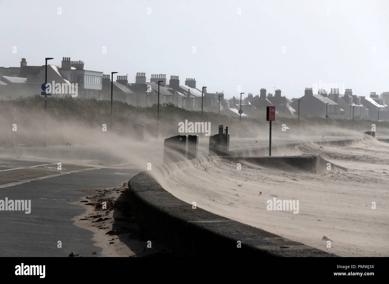 Strong winds blow sand across the seafront at Troon Beach in Ayrshire ...